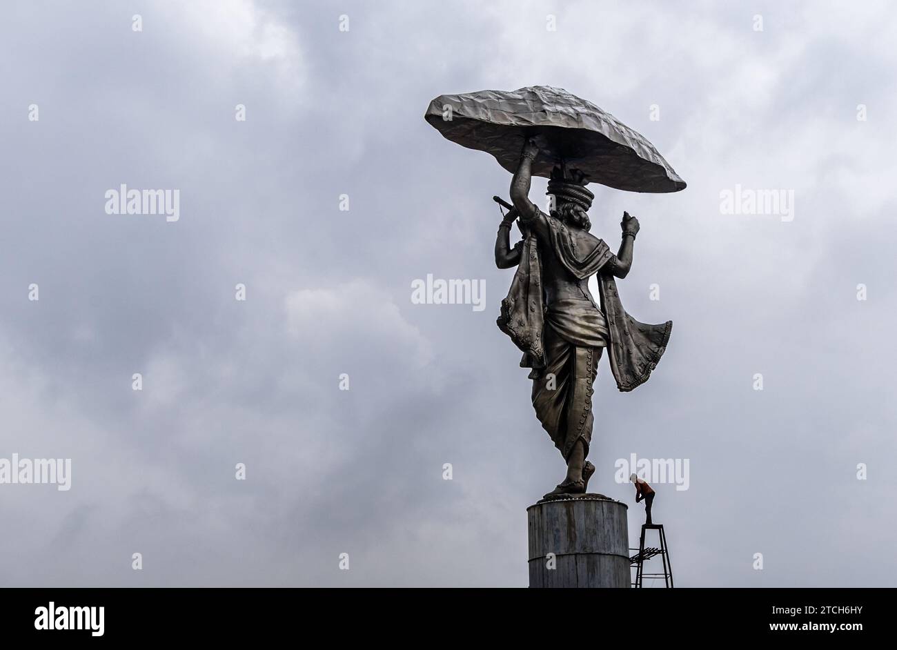 hindu god lord krishna isolated statue from behind with bright ...