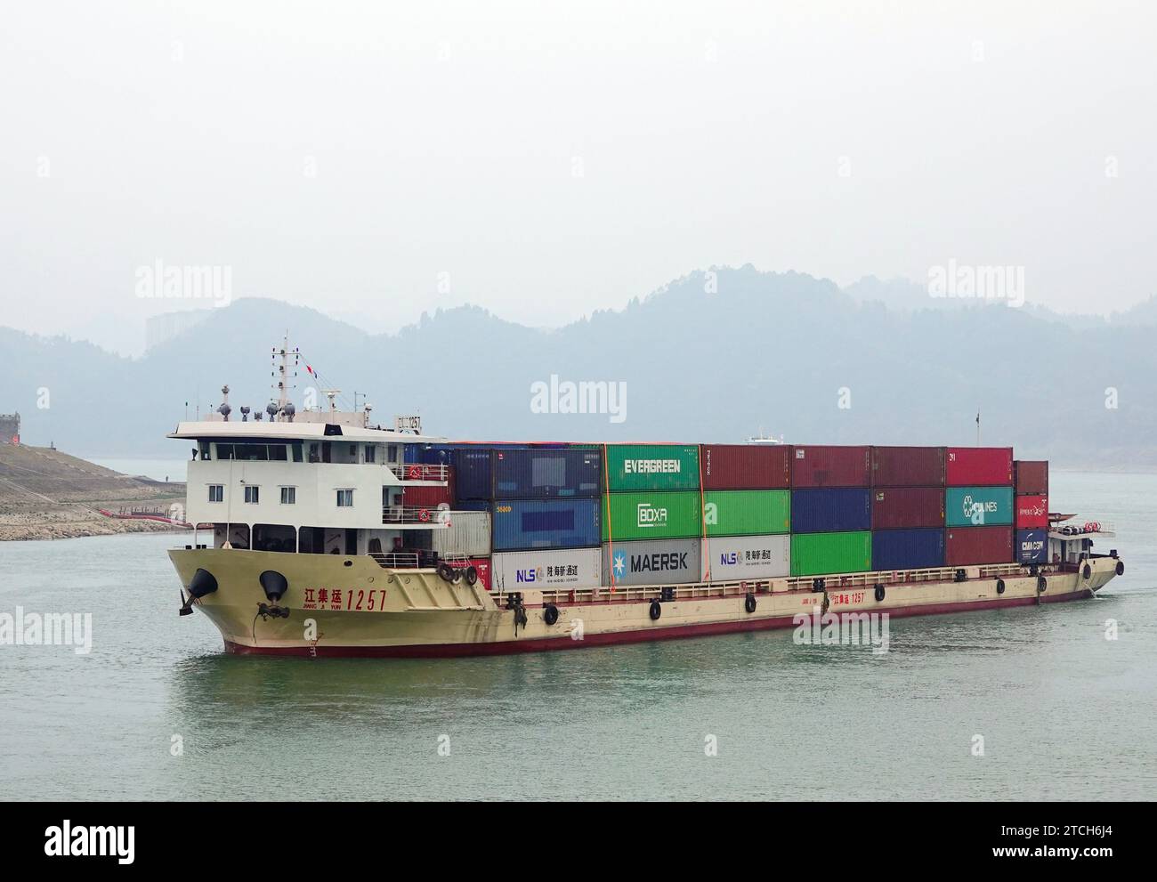 YICHANG, CHINA - DECEMBER 12, 2023 - Cargo ships loaded with containers ...