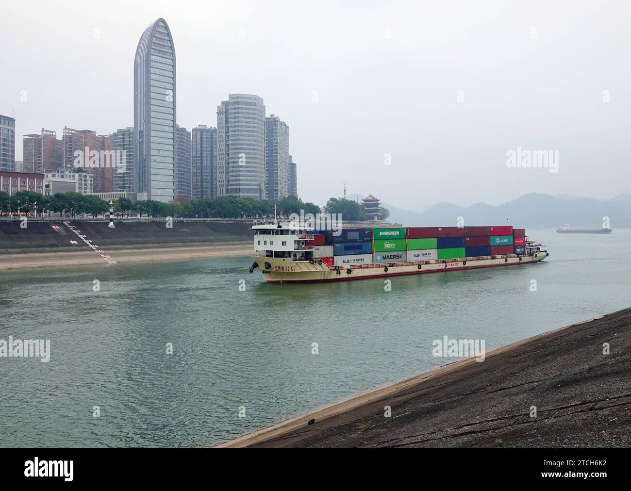 YICHANG, CHINA - DECEMBER 12, 2023 - Cargo ships loaded with containers ...