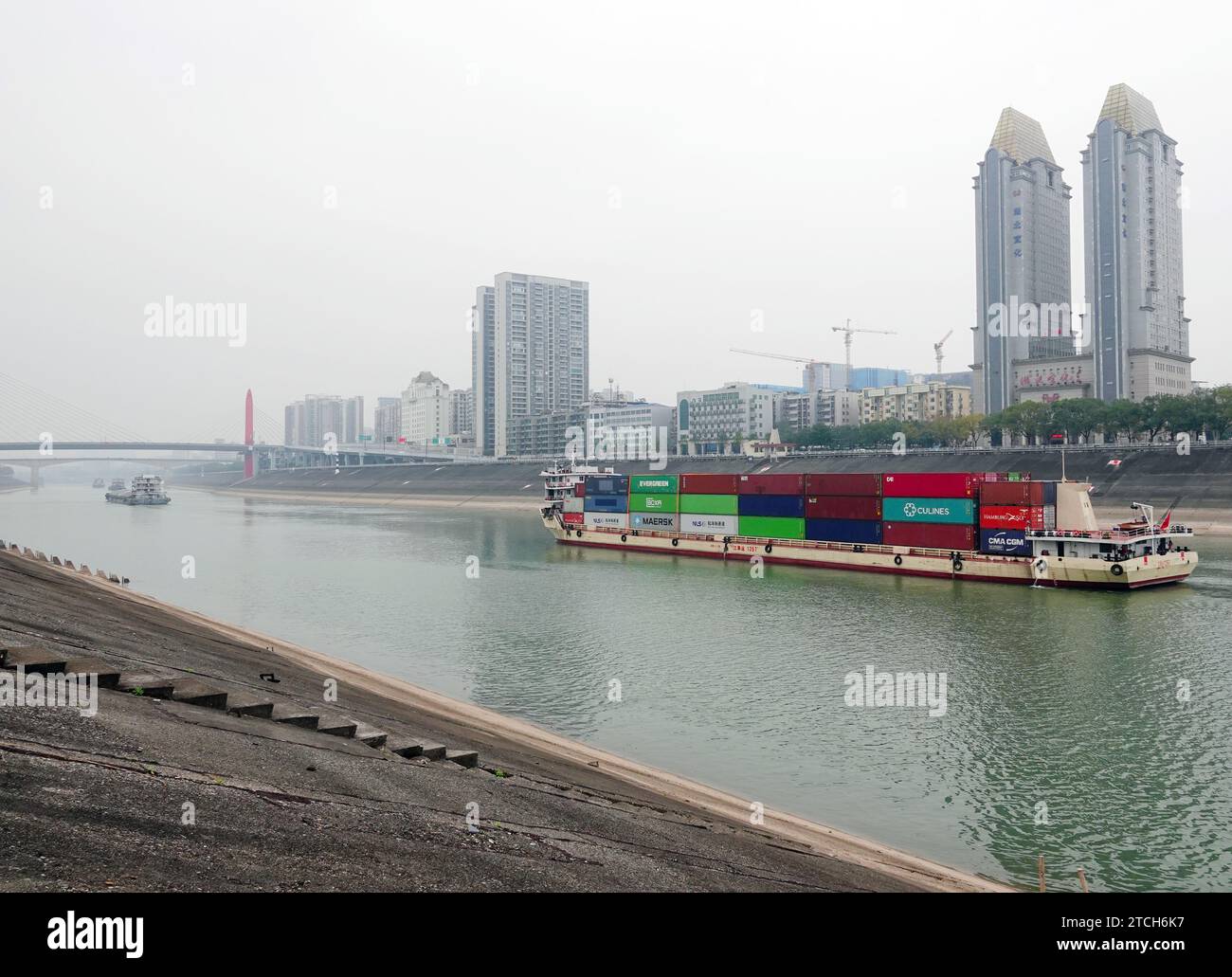 YICHANG, CHINA - DECEMBER 12, 2023 - Cargo ships loaded with containers ...