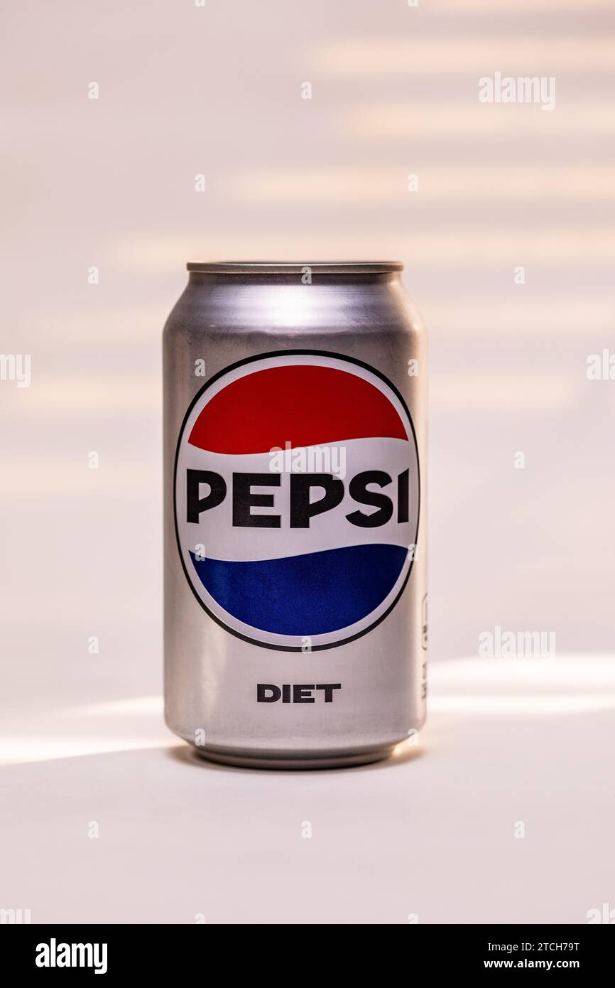 A can of Diet Pepsi on a light colored background with sunlight ...