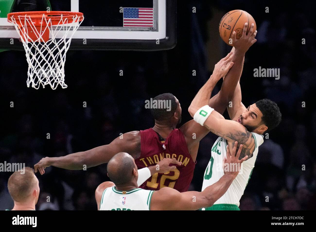 Boston Celtics forward Jayson Tatum battles for a rebound against Cleveland Cavaliers center ...