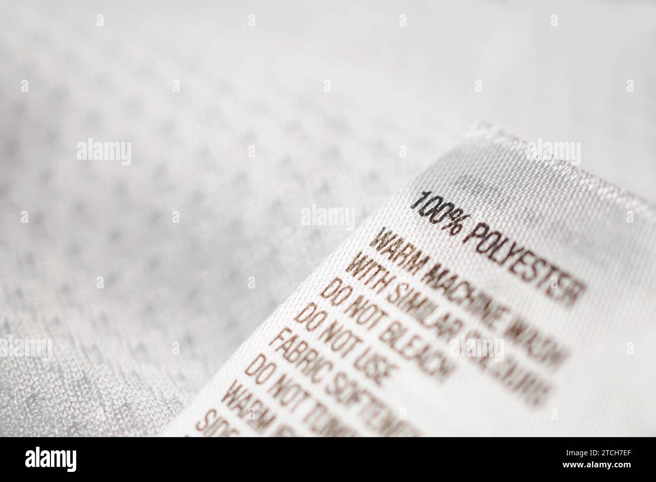 Polyester fabric Clothing label with laundry instructions Stock Photo ...