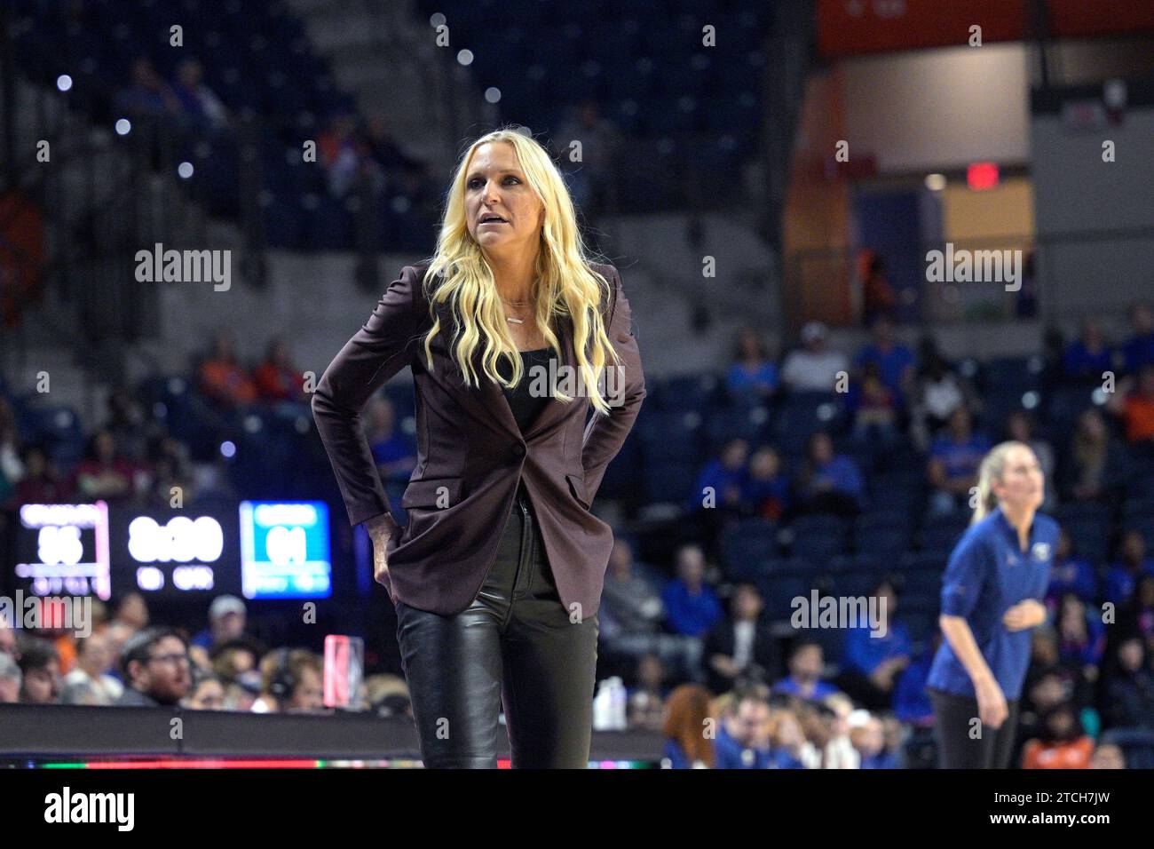 Florida State head coach Brooke Wyckoff, left, works from the sideline ...