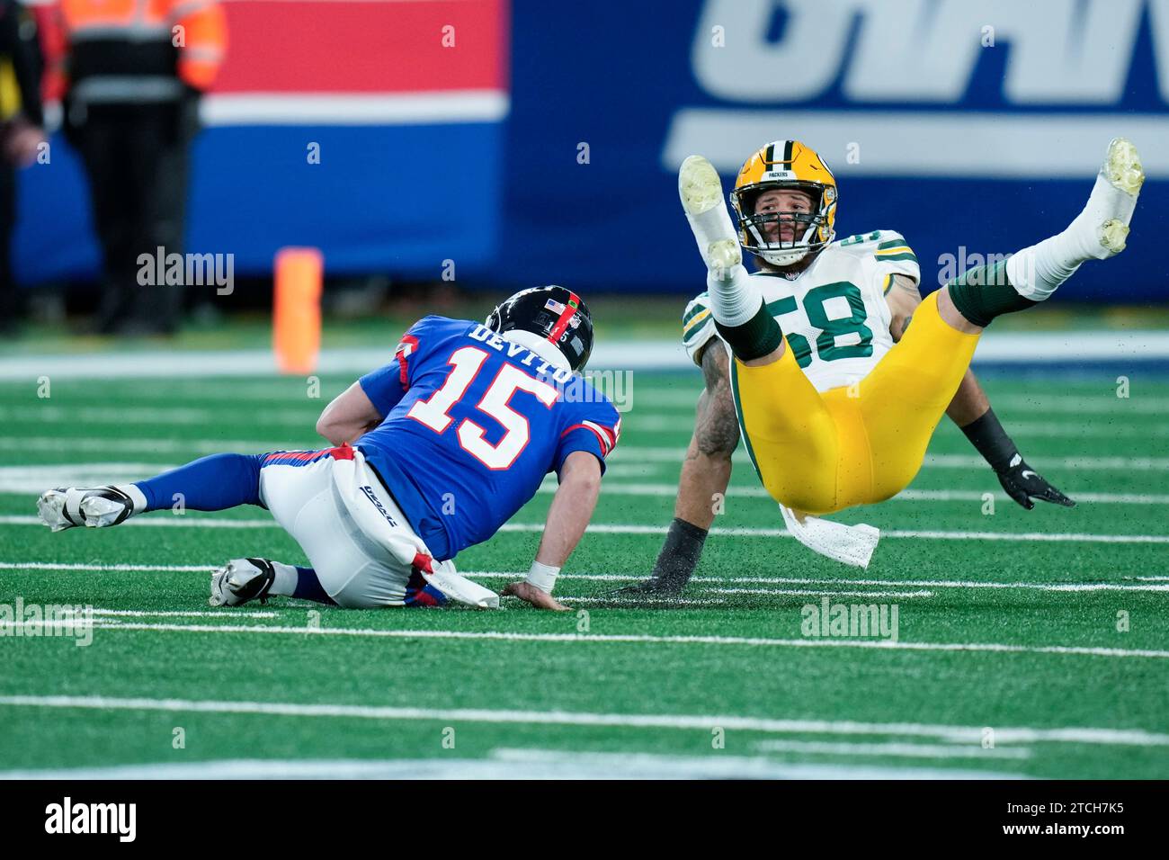 New York Giants quarterback Tommy DeVito (15) slides as Green Bay ...