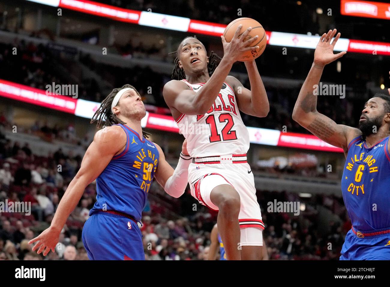 Chicago Bulls guard Ayo Dosunmu (12) drives to the basket between ...