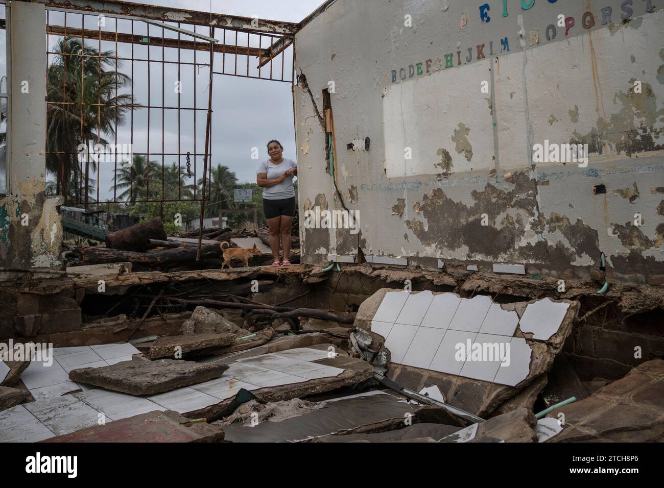 Guadalupe Cobos stands on the edge of a school building damaged by ...