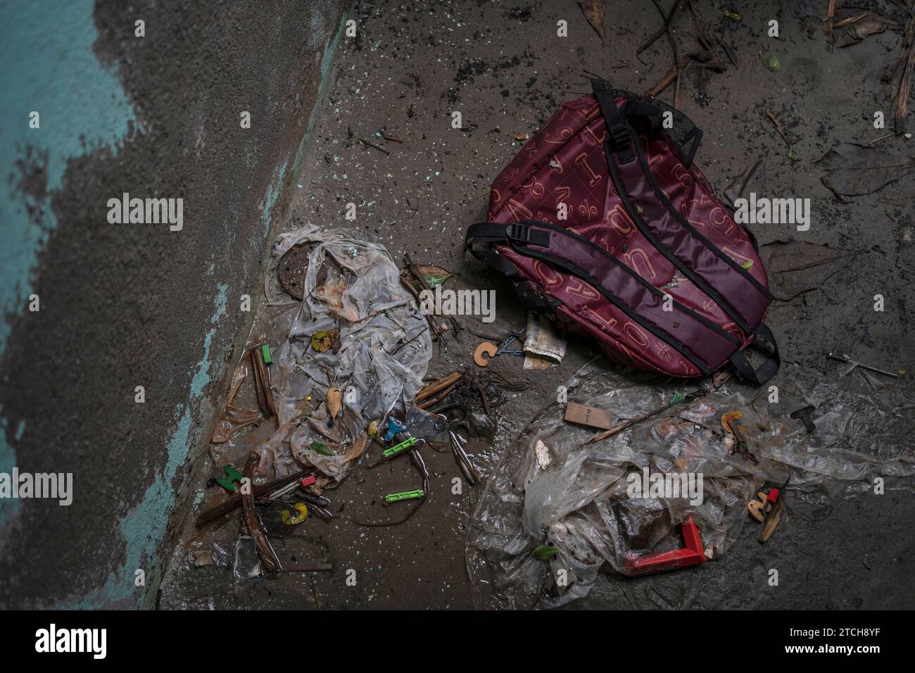 A waterlogged backpack lies in a classroom damaged by flooding driven ...