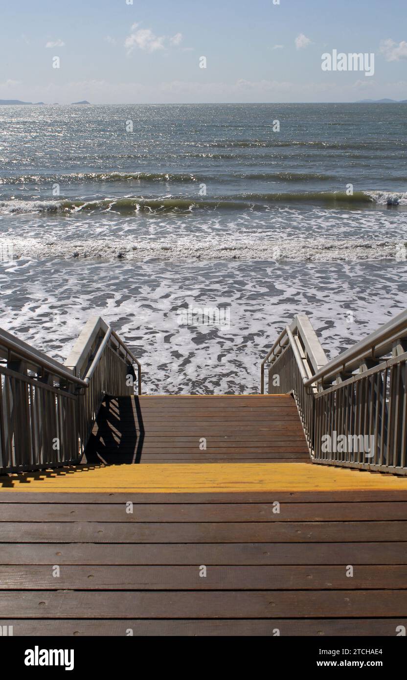 Steps leading down to the ocean with waves at a beach Stock Photo - Alamy