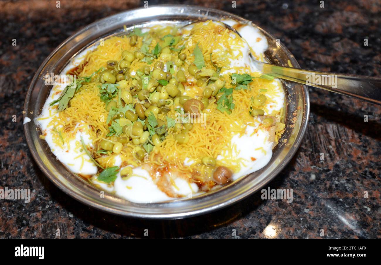 A plate of Dahi Puri served with served with Sev on top Stock Photo - Alamy