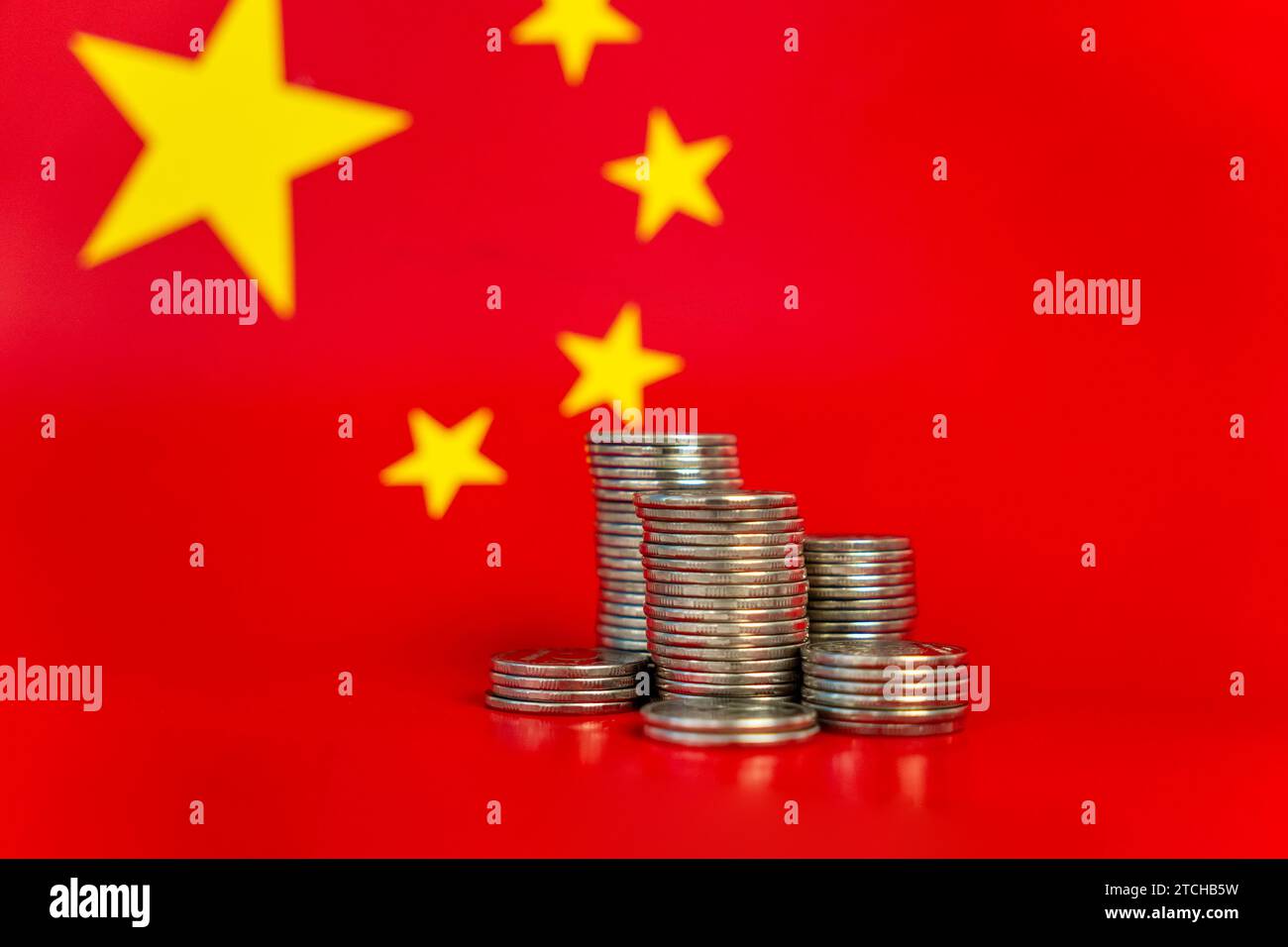 stacks of coins on the background of the China flag Stock Photo - Alamy