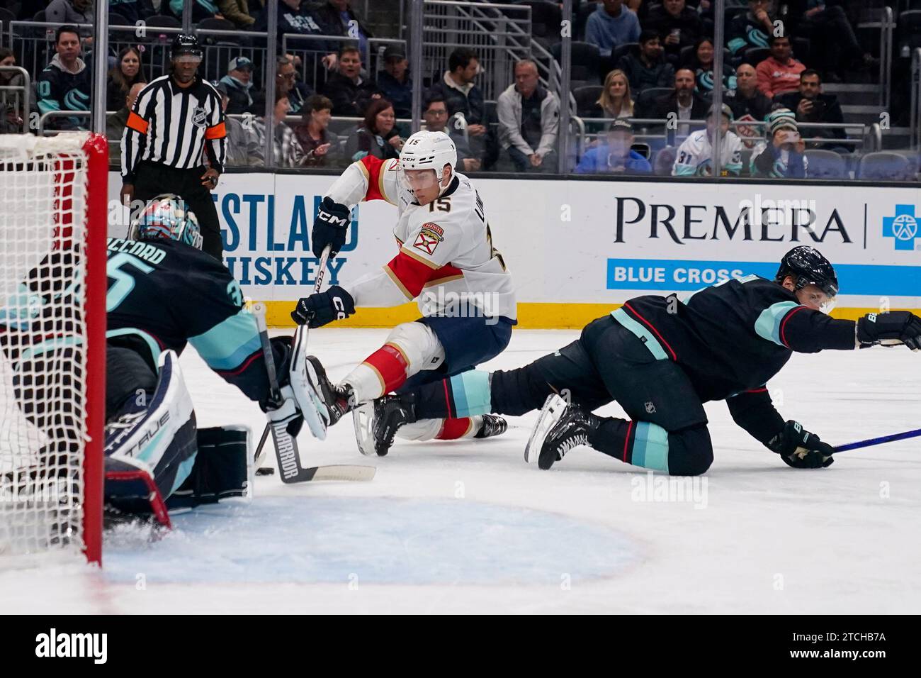 Florida Panthers center Anton Lundell (15) trips over Seattle Kraken ...