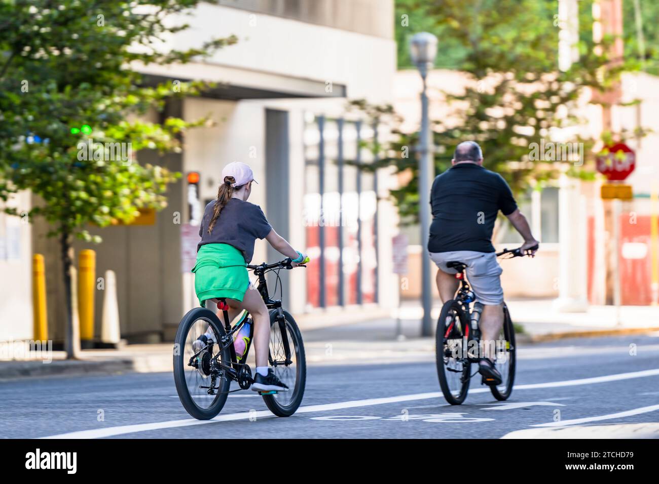 Family ride a bikes on a bike path. Use a bicycle as the main transport ...