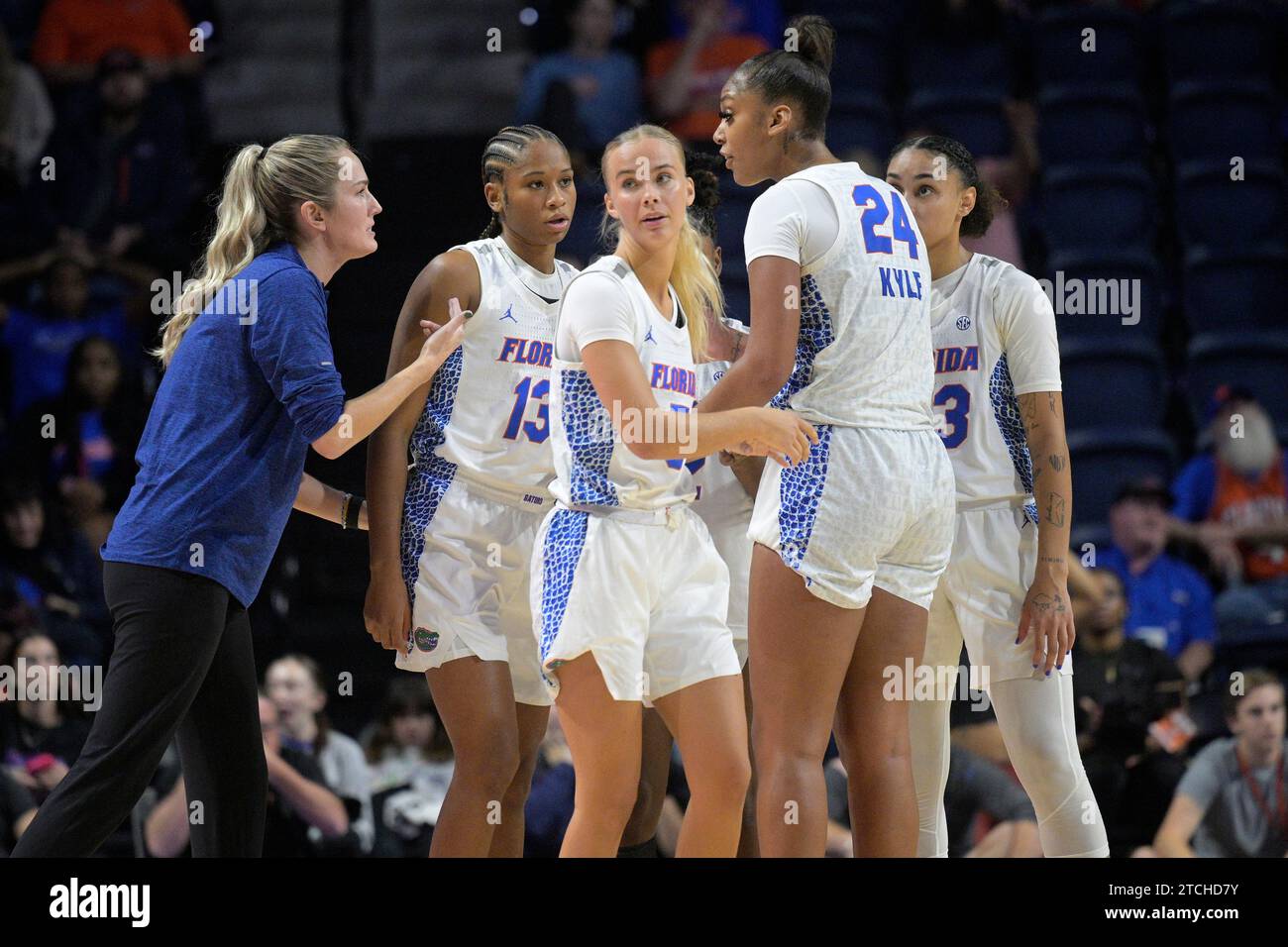 Florida head coach Kelly Rae Finley, left, talks to her players on the ...