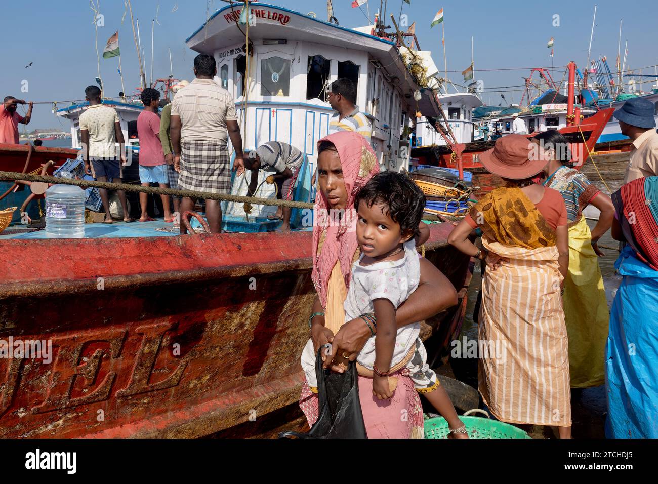 A woman from Karnataka, India, carrying her girl child on her hip ...