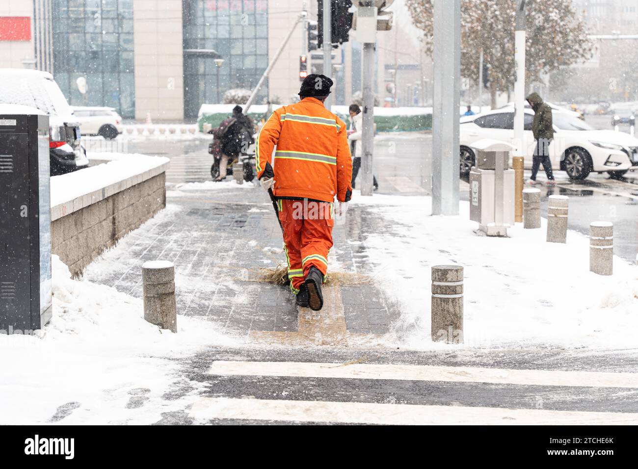 Beijing, China. 13 Dec, 2023. Communal service workers cleaning roads ...