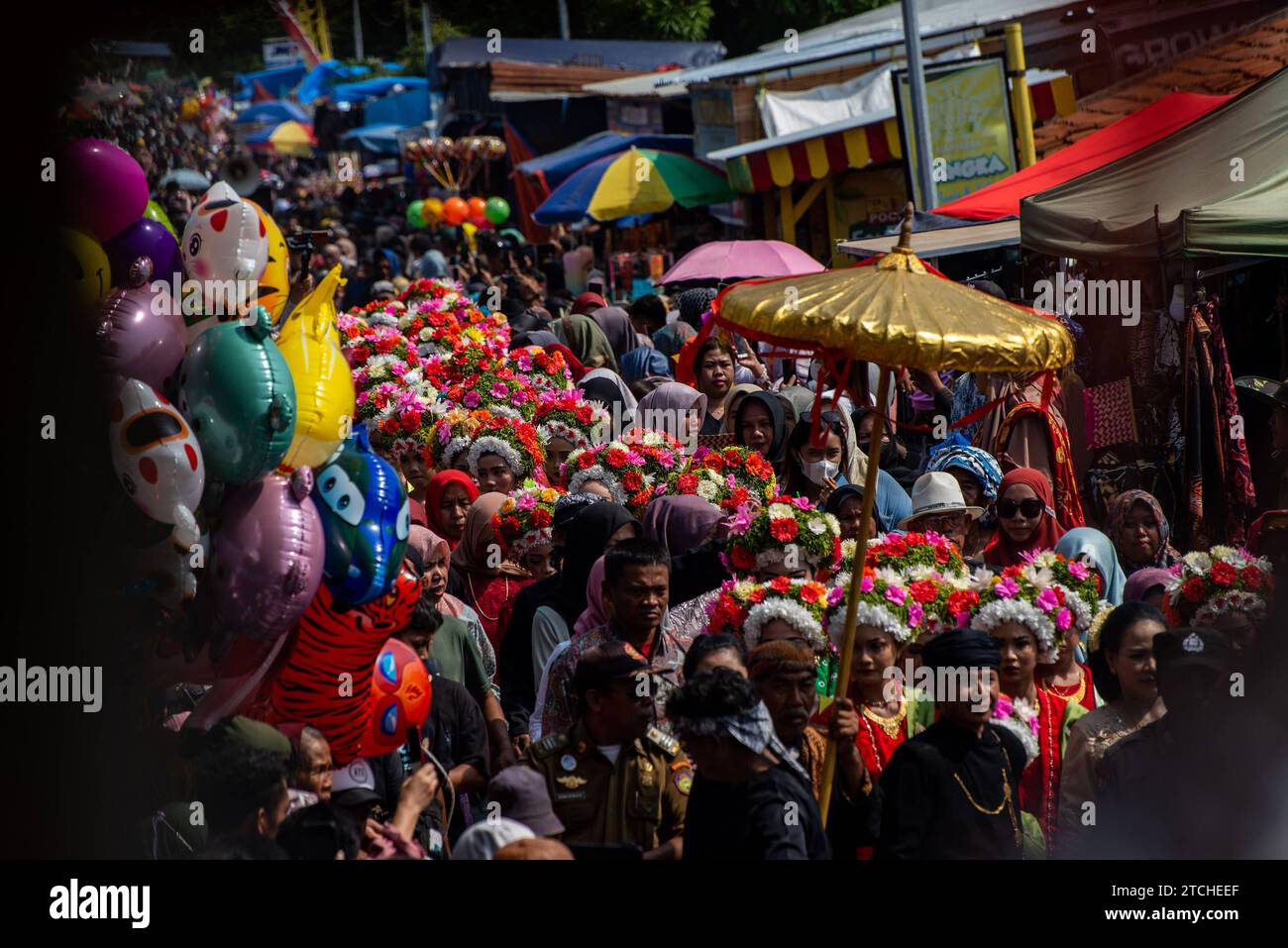 NGAROT FESTIVAL Girls decorated with flowers on their heads participate ...