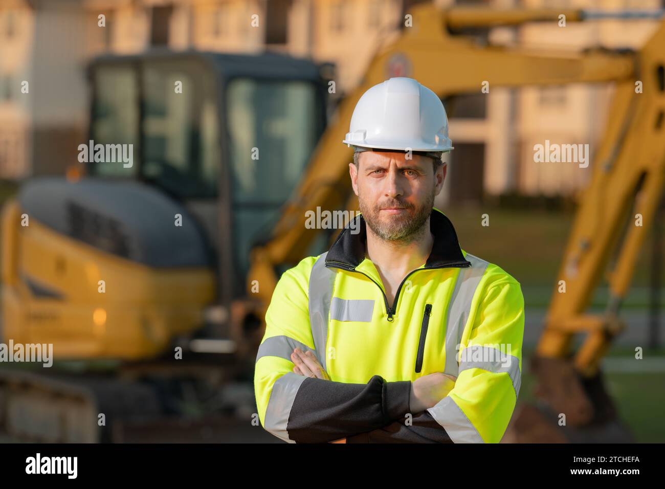 Builder with excavator for construction at the construction site ...
