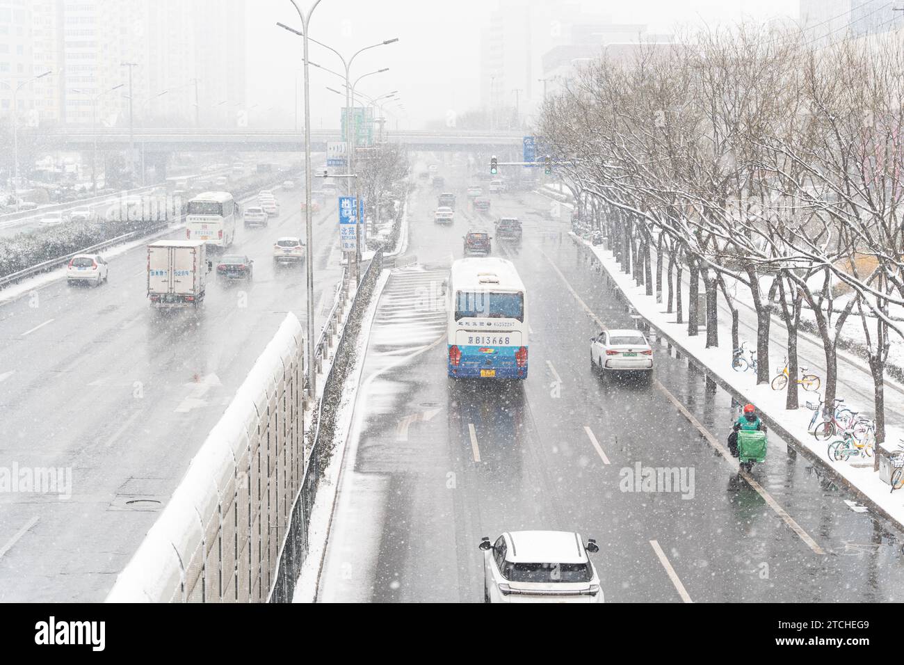 Beijing, China. 13 Dec, 2023. People of Beijing in a snowstorm, commute ...