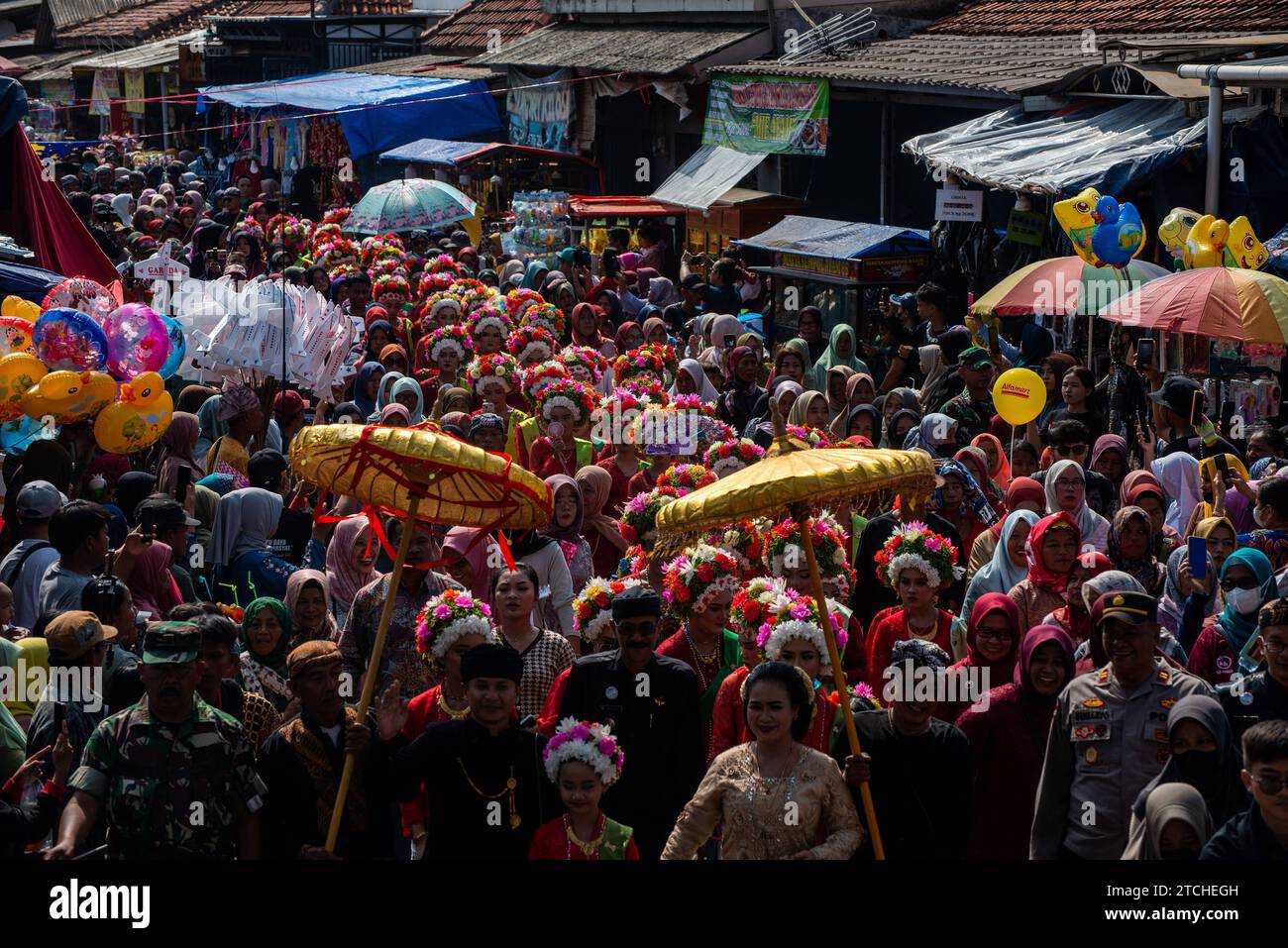 NGAROT FESTIVAL Girls decorated with flowers on their heads participate ...