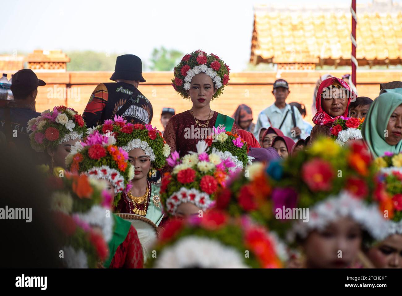 NGAROT FESTIVAL Girls decorated with flowers on their heads participate ...