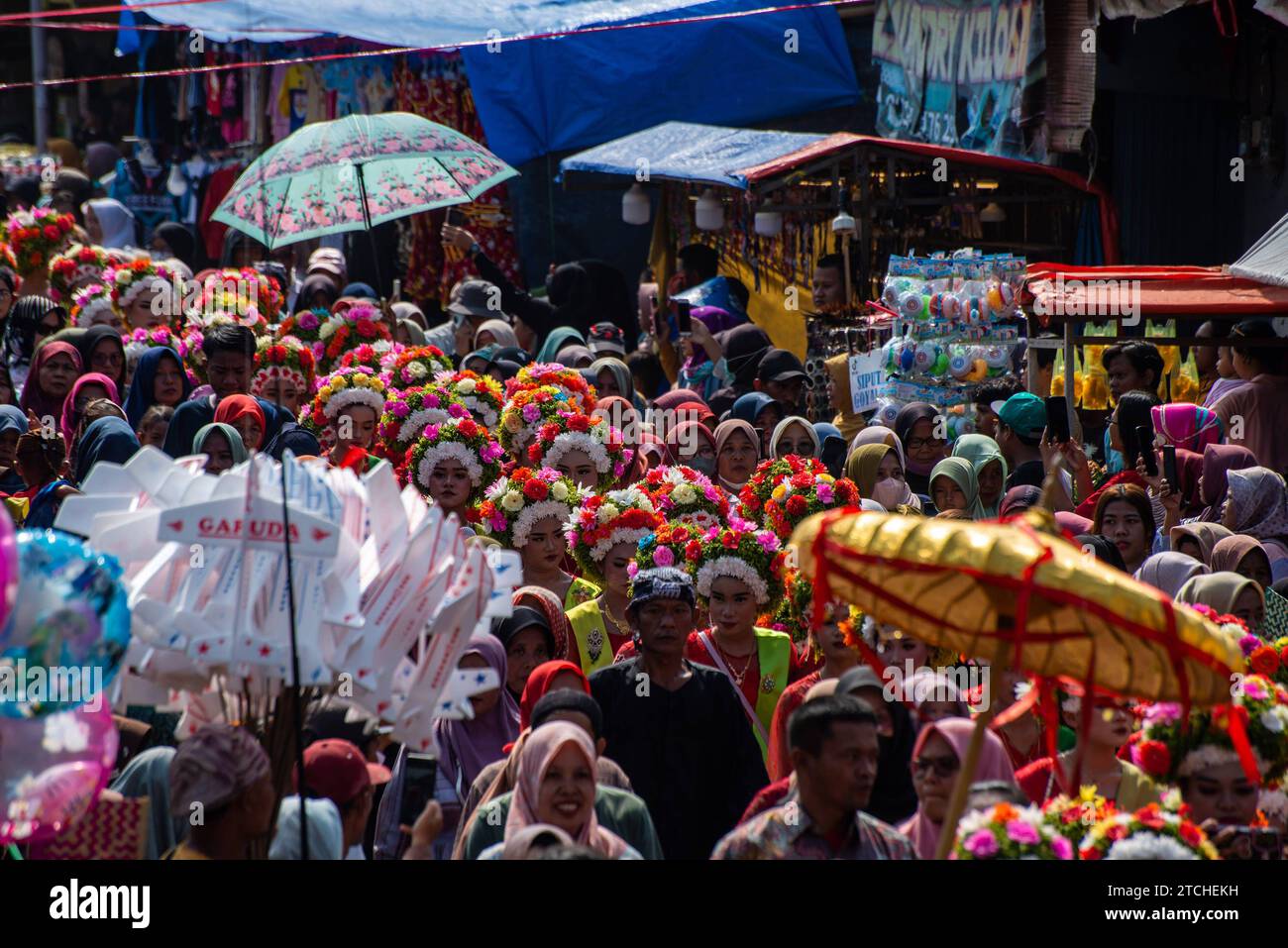 NGAROT FESTIVAL Girls decorated with flowers on their heads participate ...