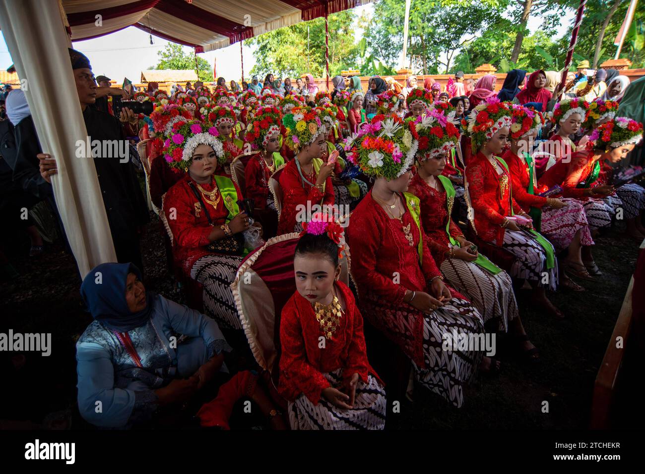 NGAROT FESTIVAL Girls decorated with flowers on their heads participate ...
