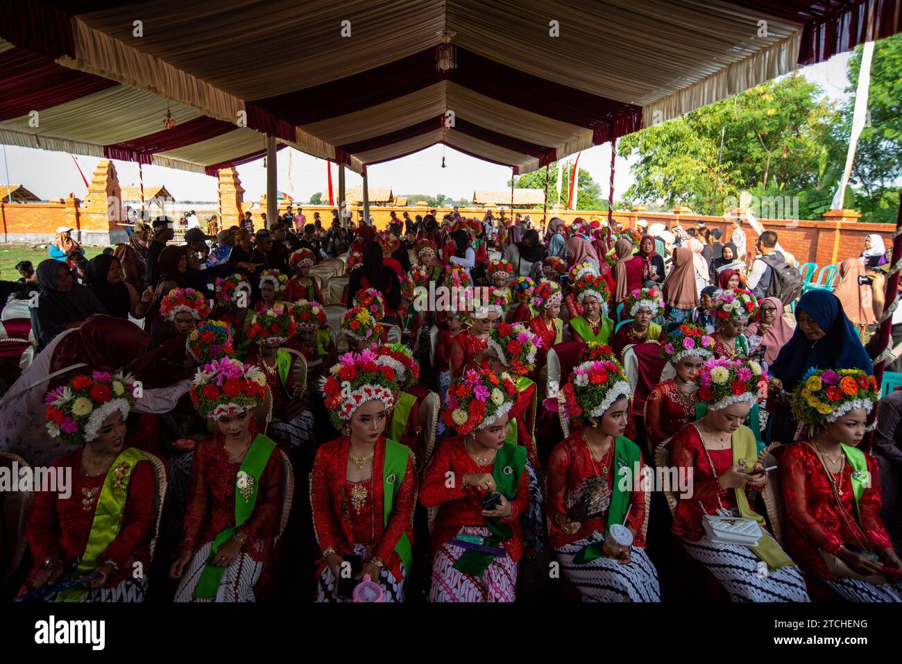 NGAROT FESTIVAL Girls decorated with flowers on their heads participate ...