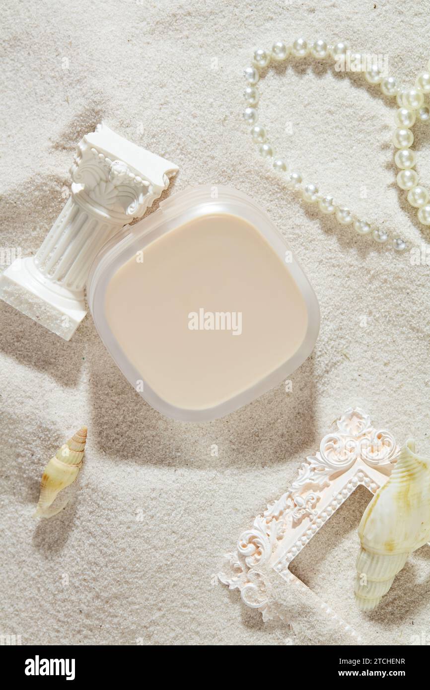 An unlabeled foundation box, pearl necklace and some decorations are ...