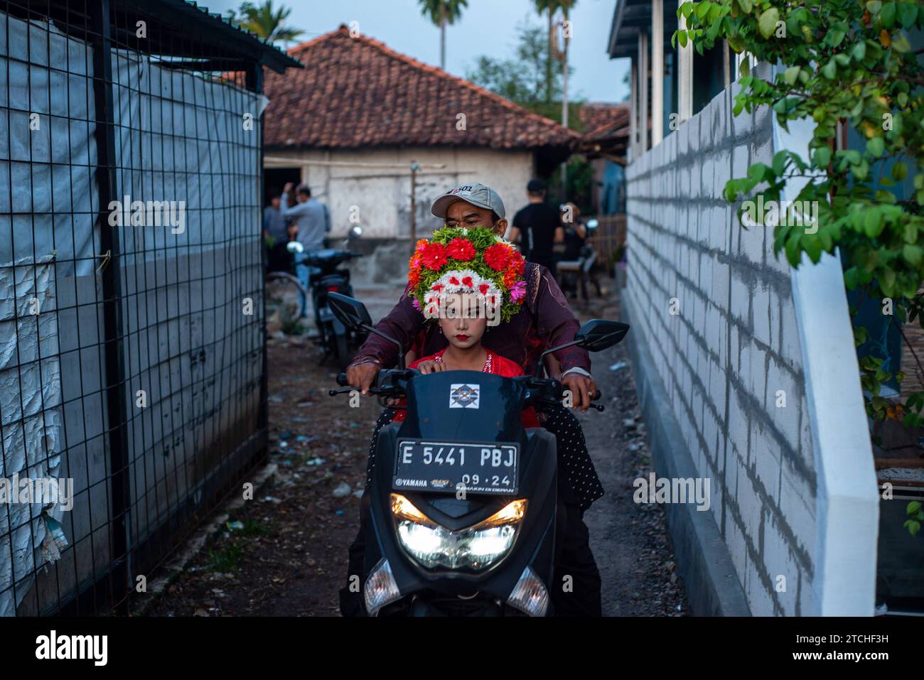 NGAROT FESTIVAL Girls decorated with flowers on their heads participate ...