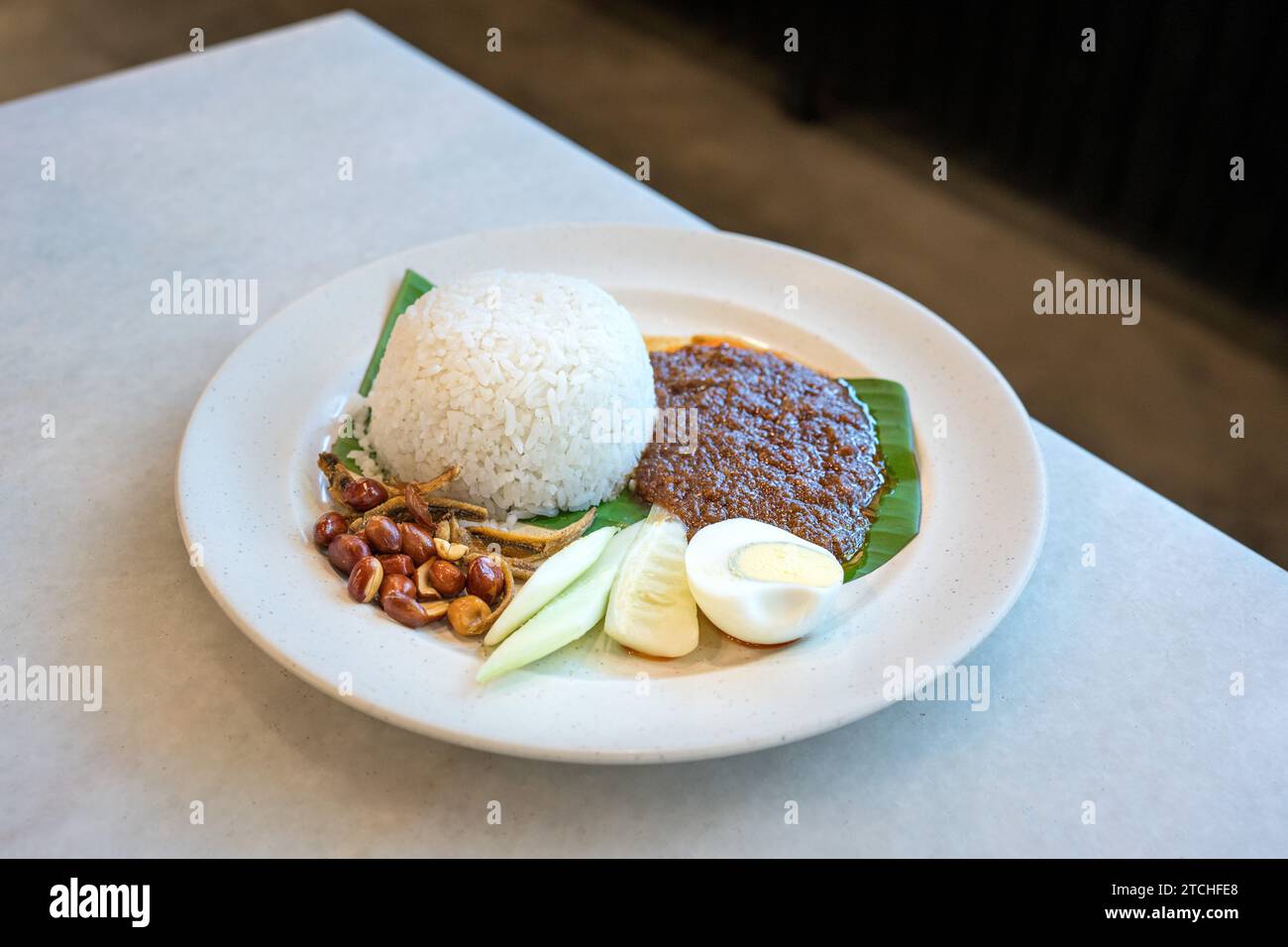 Nasi Lemak, a malay style meal of fragrant rice cooked in coconut milk ...