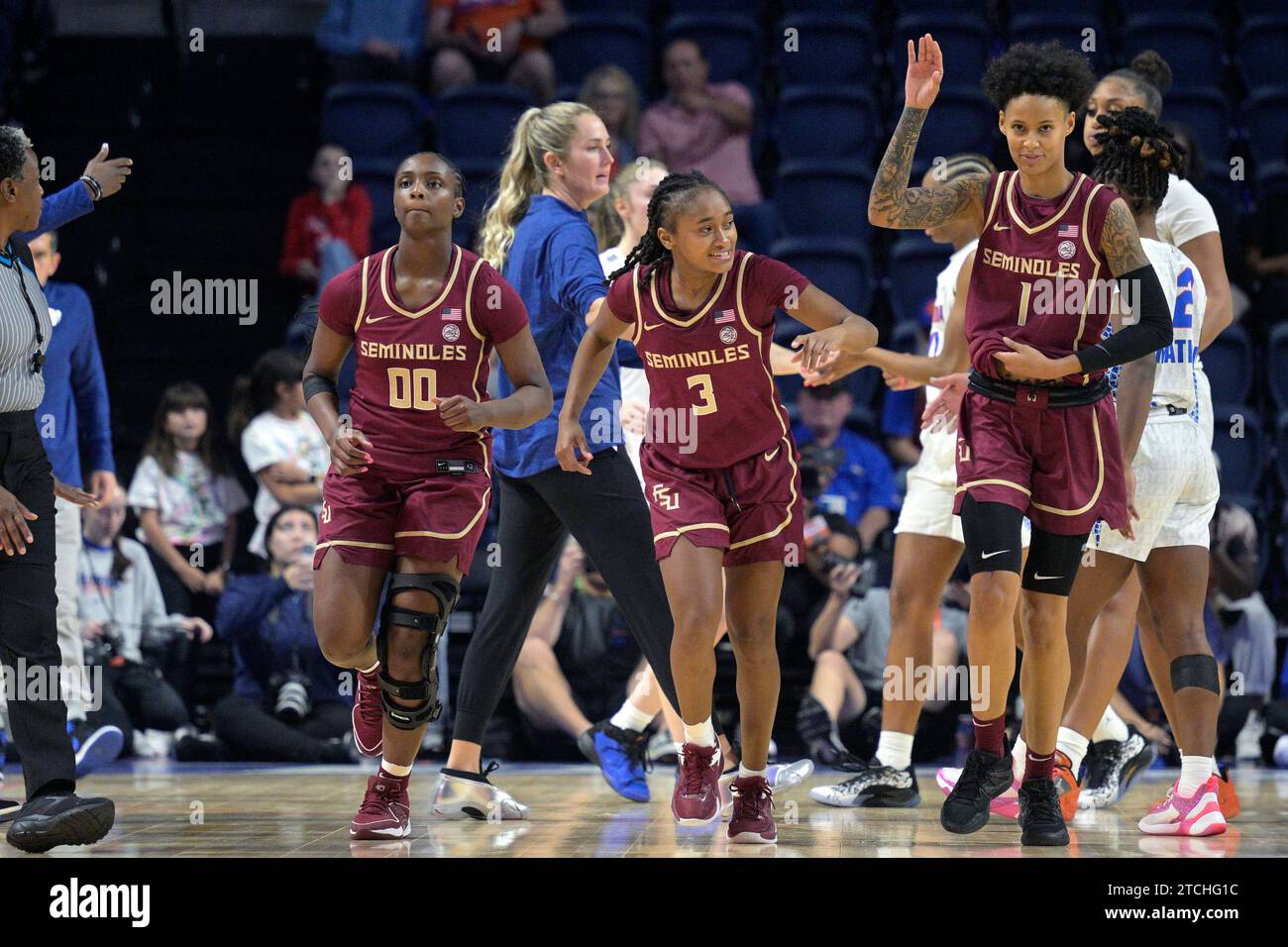 Florida State guard Ta'Niya Latson (00), guard O'Mariah Gordon (3) and guard Brianna Turnage (1 ...