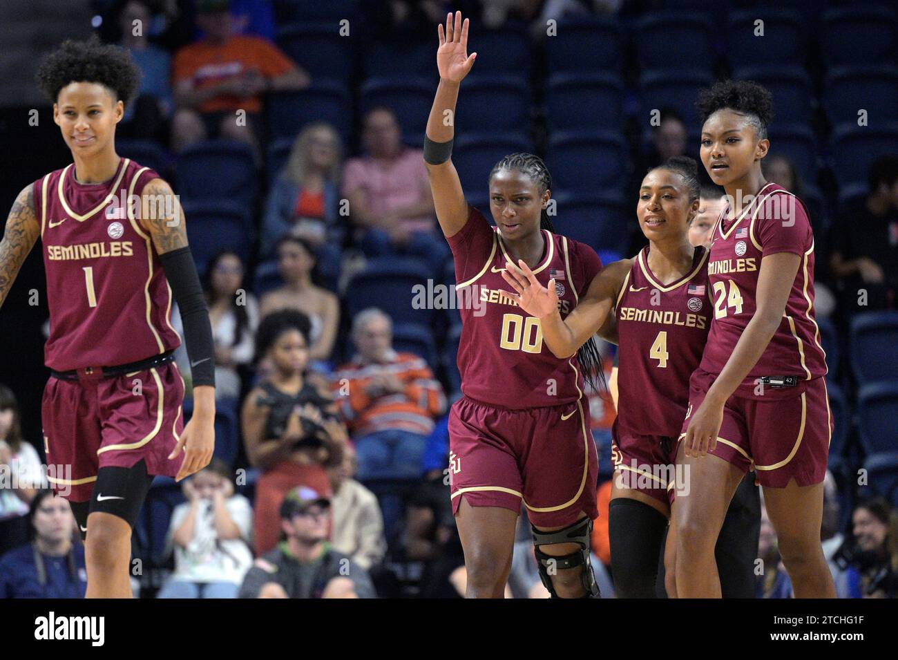 Florida State guard Brianna Turnage (1), guard Ta'Niya Latson (00), Sara Bejedi (4) and guard ...