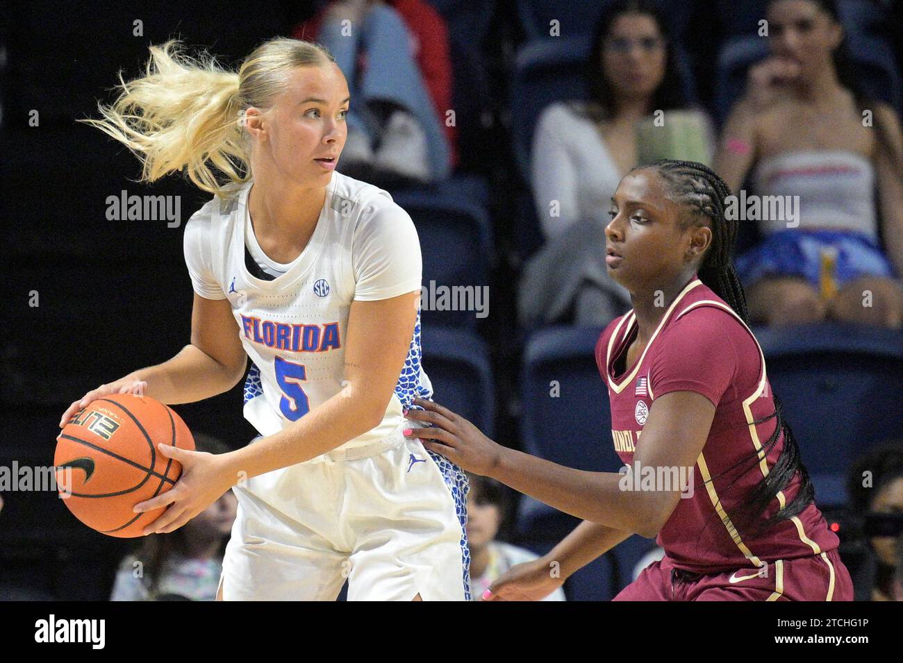 Florida guard Alberte Rimdal (5) is defended by Florida State guard Ta'Niya Latson, right ...