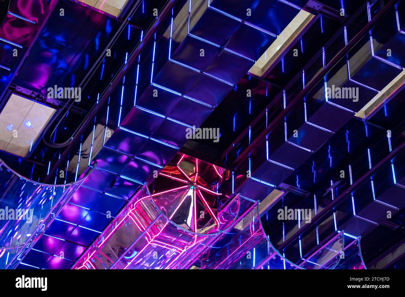 The neon steampunk light in interior of a modern building with an glass elevator Stock Photo - Alamy