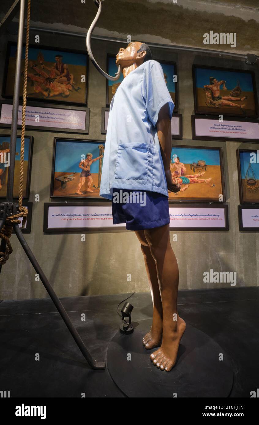 A display of a typical prisoner, attached to a big iron hook. The hook ...