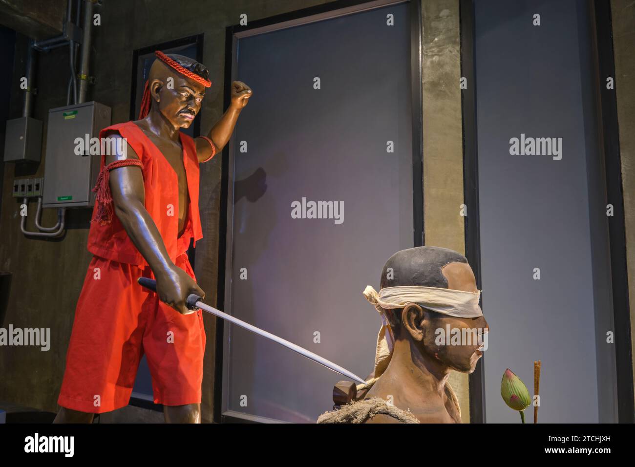 A display of an execution by sword, a beheading. The prisoner is ...