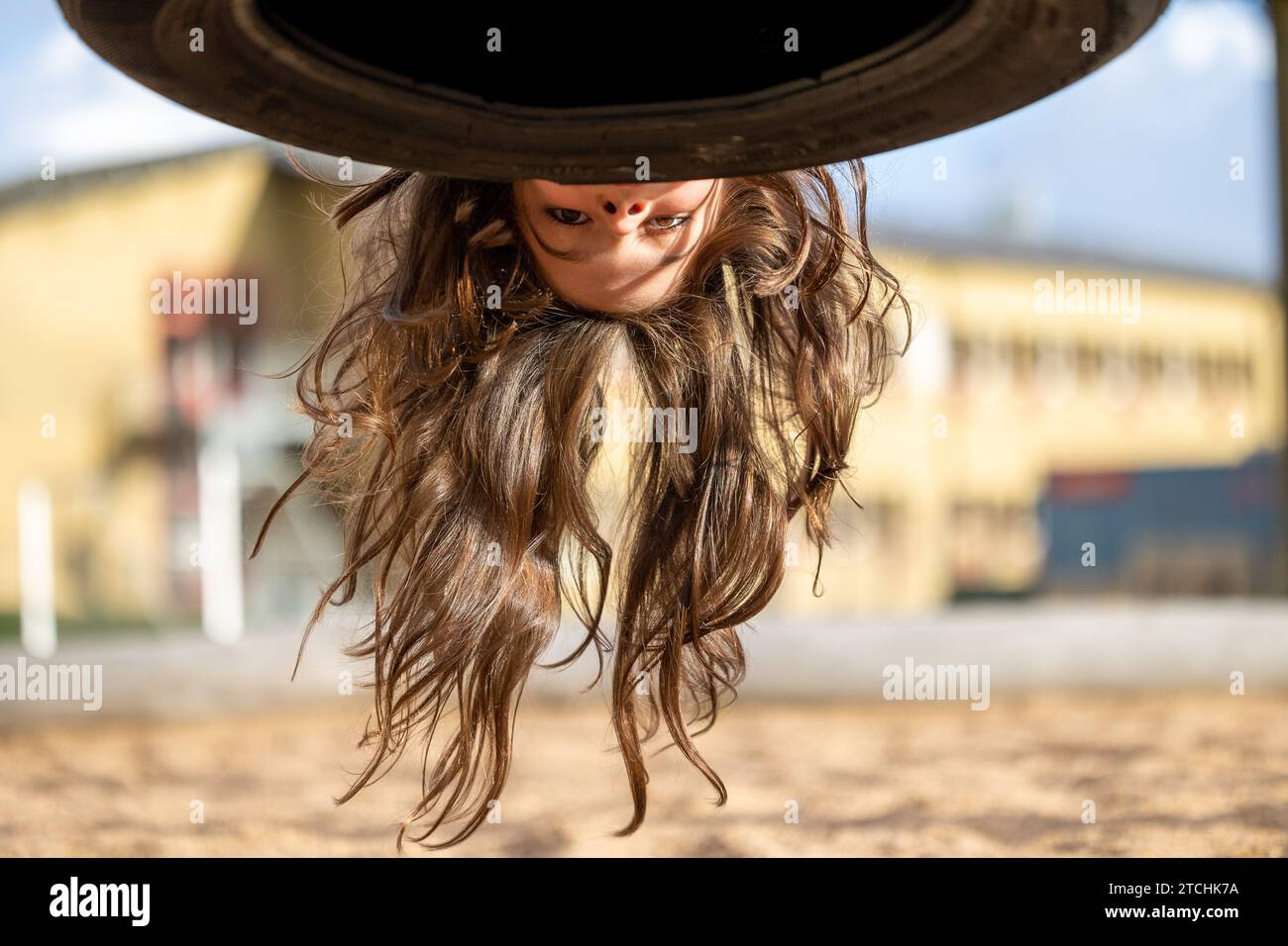 A young female human is in an upside-down position Stock Photo - Alamy