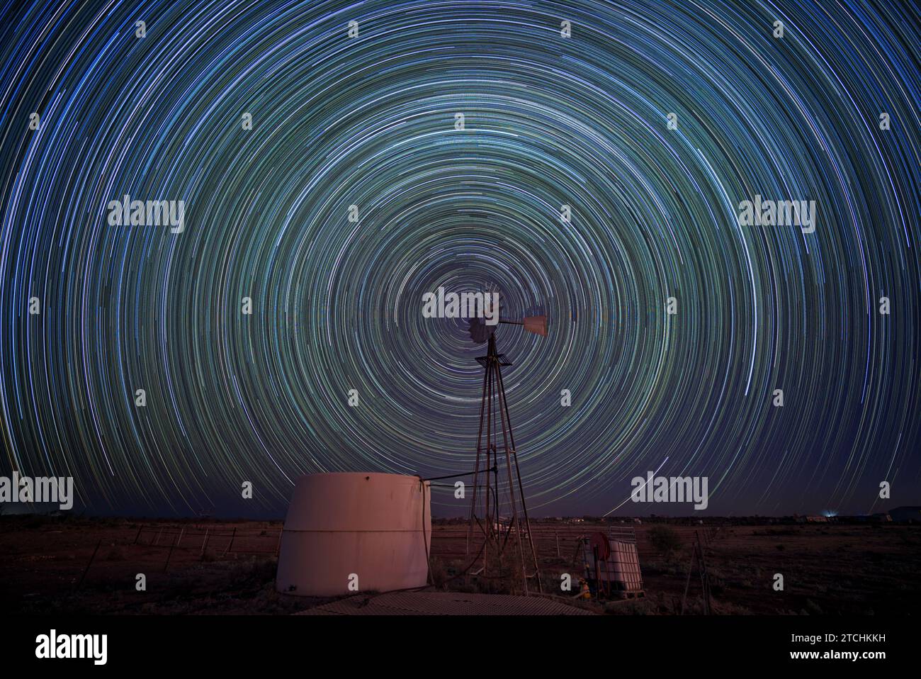Star trails caused by the Earth's rotation captured above a wind ...