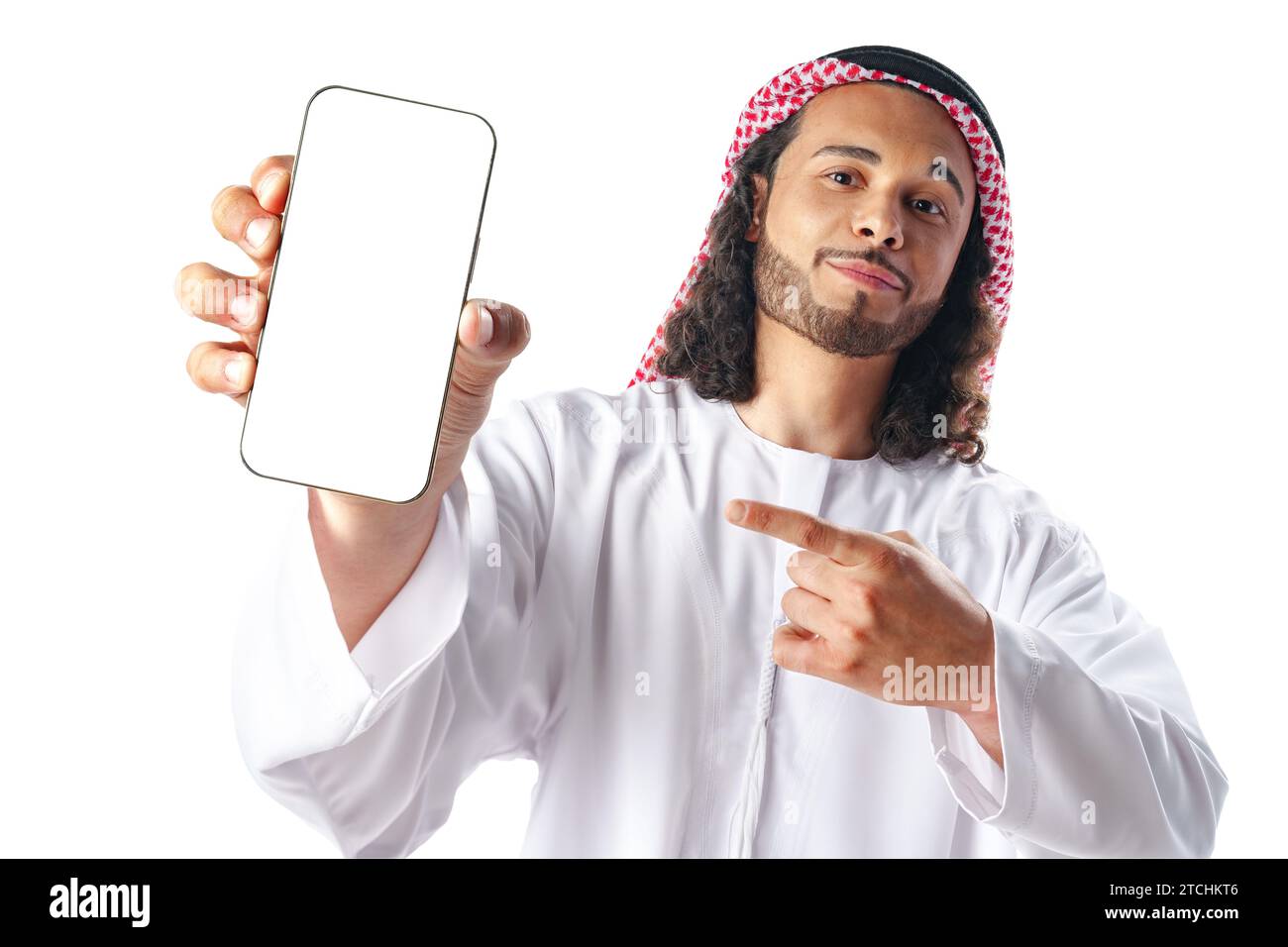Young Arab man in traditional dress thobe showing smartphone with blank ...