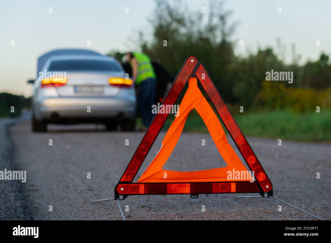 Car standing near stop sign hi-res stock photography and images - Alamy