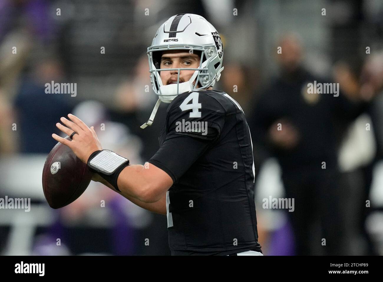 Las Vegas Raiders quarterback Aidan O'Connell (4) warms up before an ...