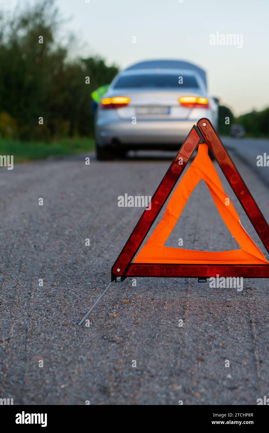 Car standing near stop sign hi-res stock photography and images - Alamy