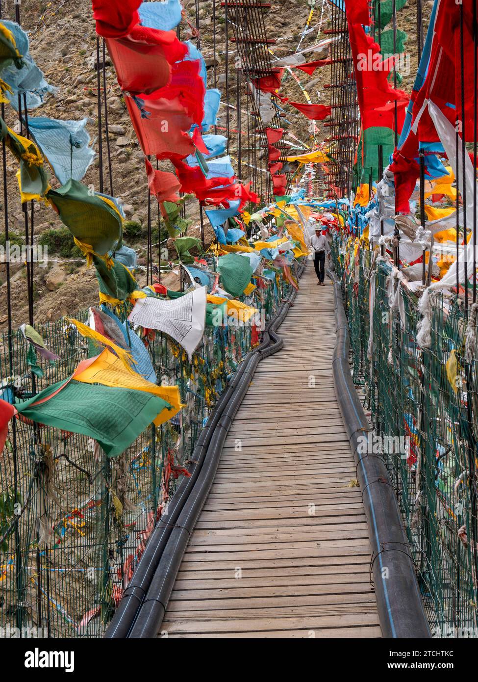Suspension bridge with prayer flags, highlands of Tibet, China Stock ...