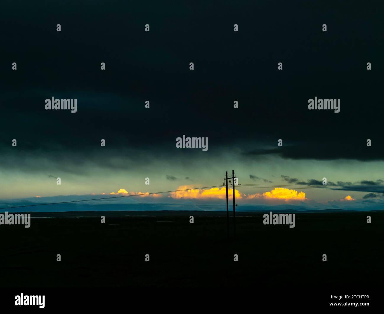 Power lines in a dramatic evening mood, highlands of Tibet, China Stock ...