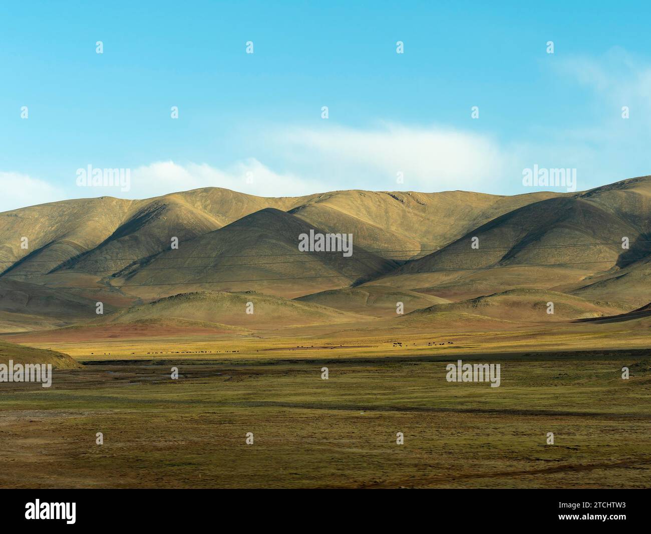 Mountain landscape and vast plain in the highlands of Tibet, China ...