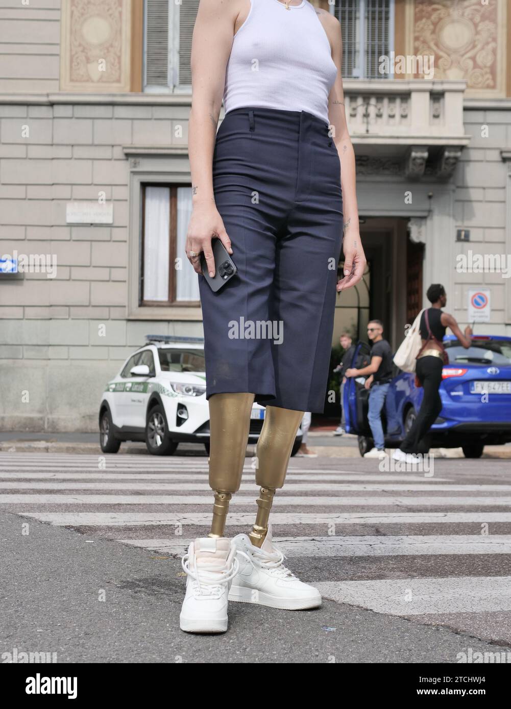 Woman with artificial limbs posing in the street during Milan fashion ...