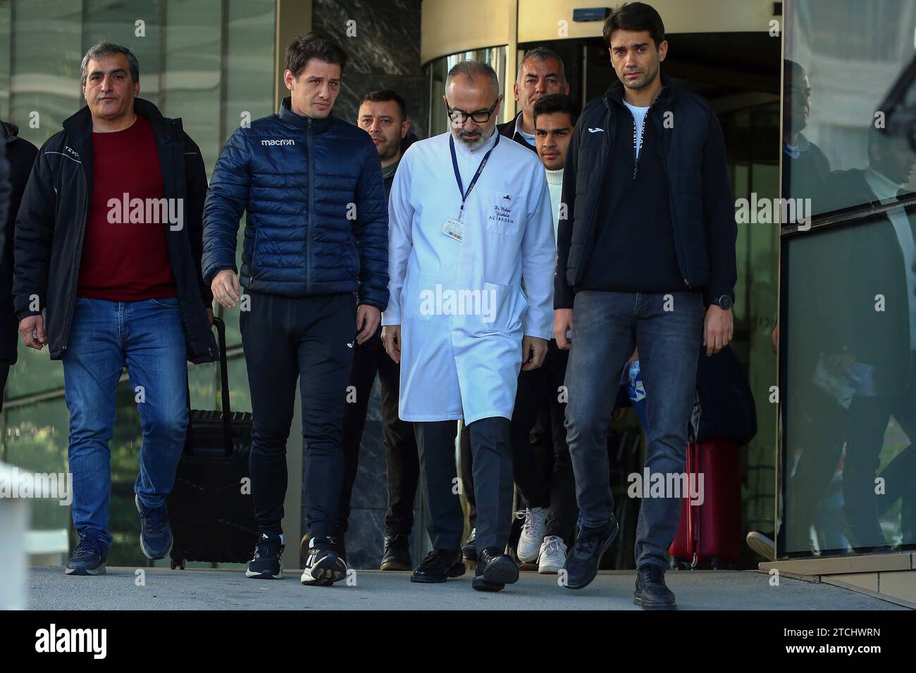 Turkish referee Halil Umut Meler, second left, leaves the Acibadem ...