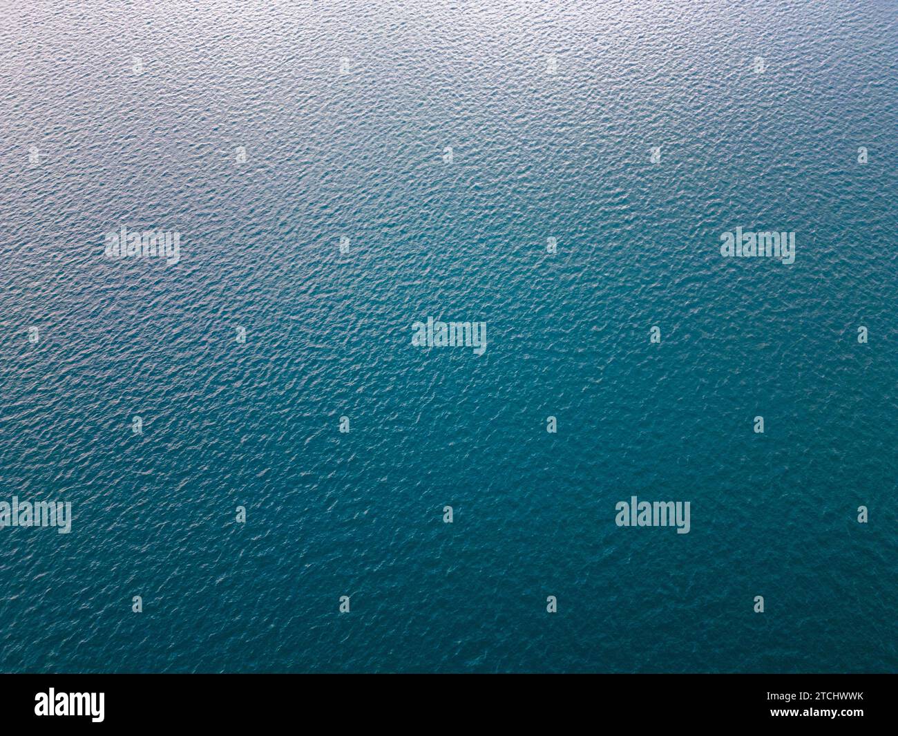 Aerial view of the sea surface pattern reflecting the sky background ...
