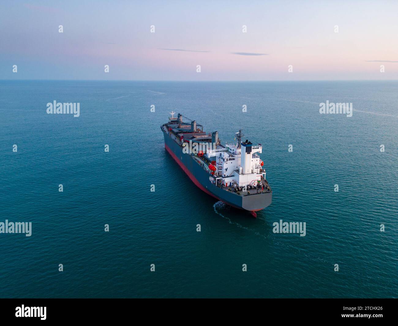 A massive cargo ship wood chips carrier in the sea, aerial view Stock ...